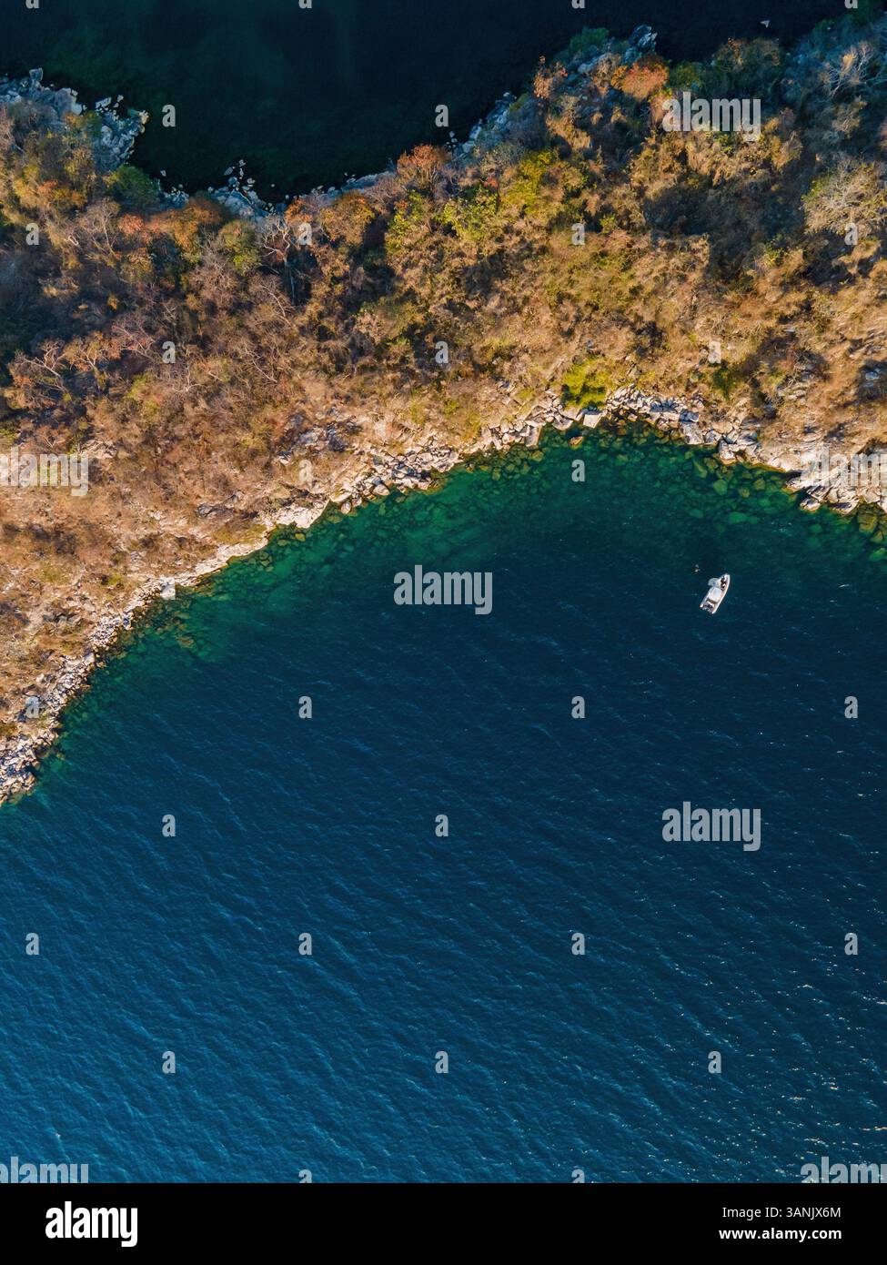 Aerial view of Boadzulu Island speed boat on Southern Lake Malawi ...