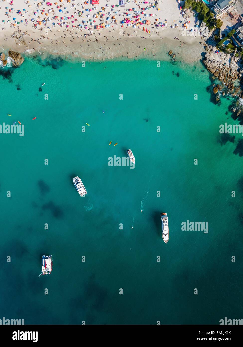 Aerial view of Clifton 4th pristine beach with luxury yachts docked and ...