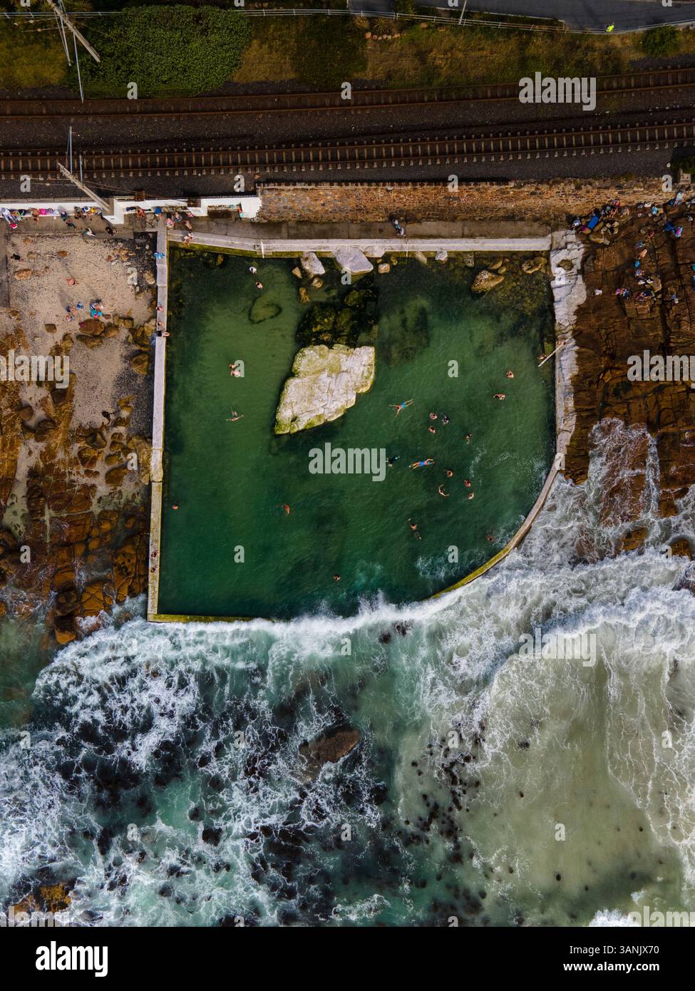 Aerial view of Dalebrook tidal pool early morning swimmers, Cape Town ...