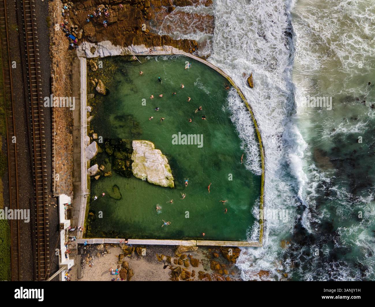 Aerial view of Dalebrook tidal pool early morning swimmers, Cape Town ...