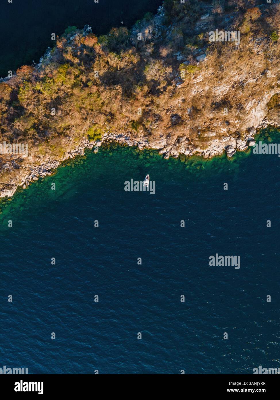 Aerial view of Boadzulu Island speed boat on Southern Lake Malawi ...