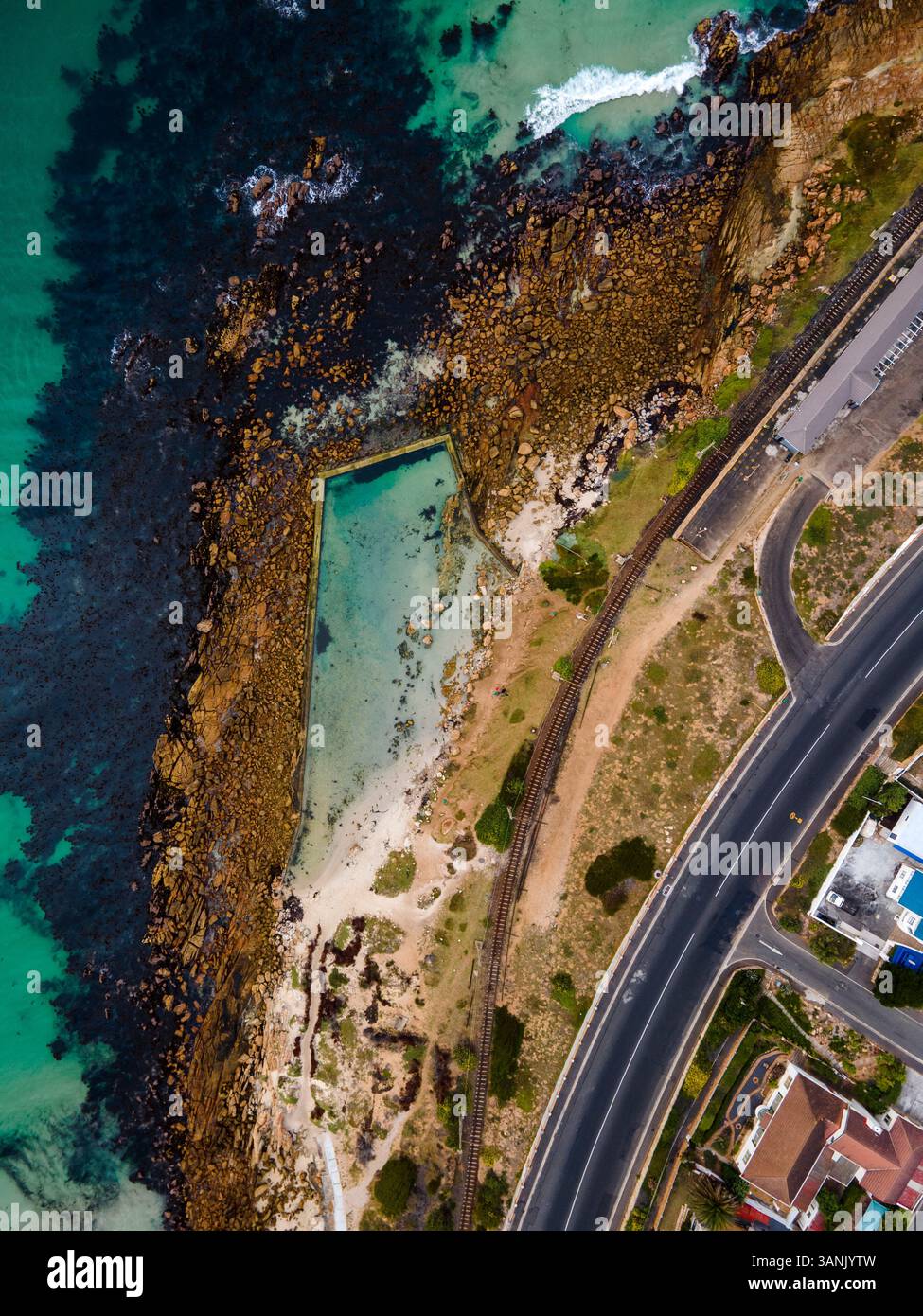 Aerial view of Glencairn tidal pool along the coastline in summertime ...