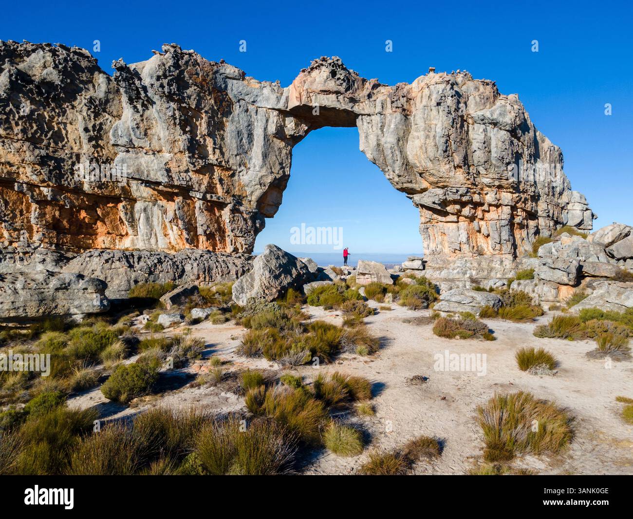 Aerial view of woman in red jacket at Wolfberg Arch hiking, Western ...