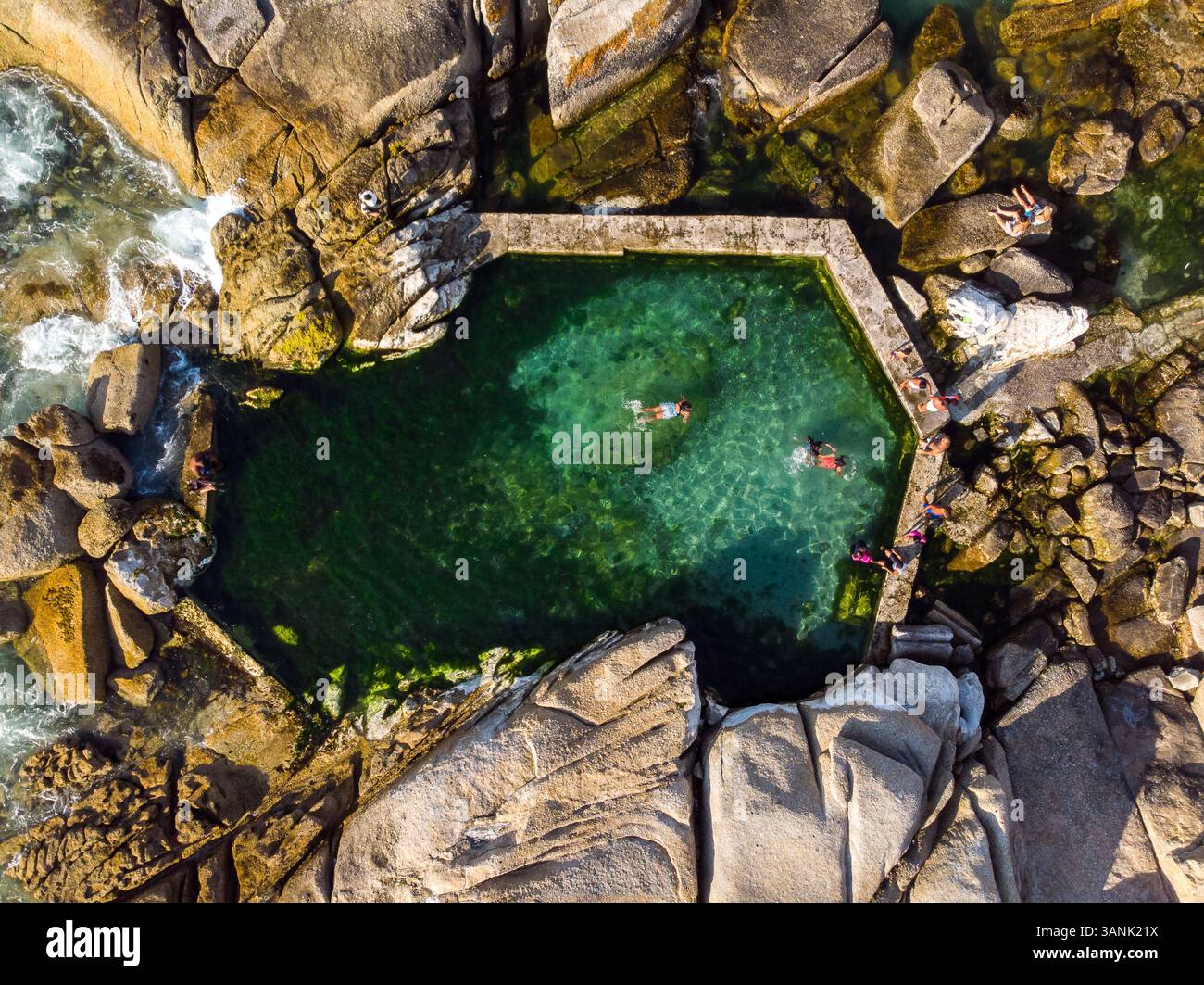 Aerial view of swimmers at Saunders Rock tidal Pool, Cape Town, South ...