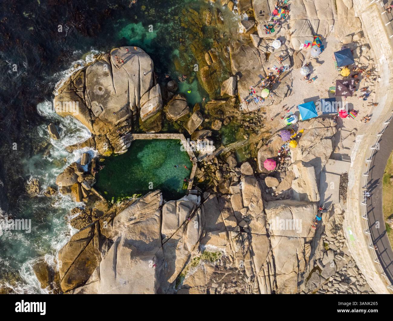 Aerial view of swimmers at Saunders Rock tidal Pool, Cape Town, South ...