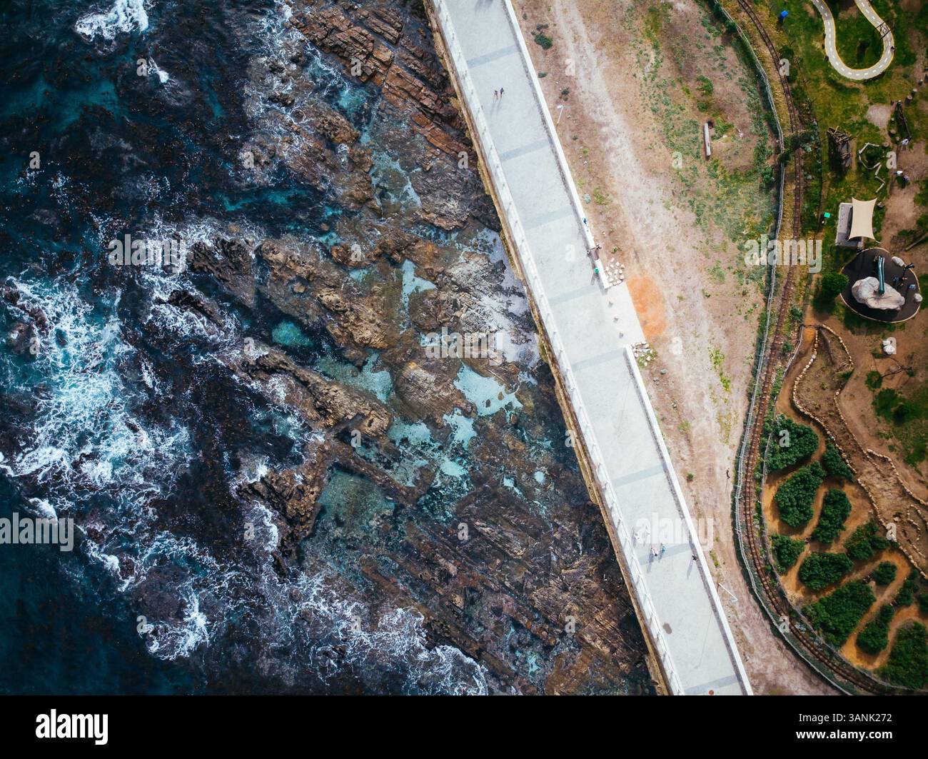 Aerial view of people walking at Sea Point Promenade with Atlantic ...