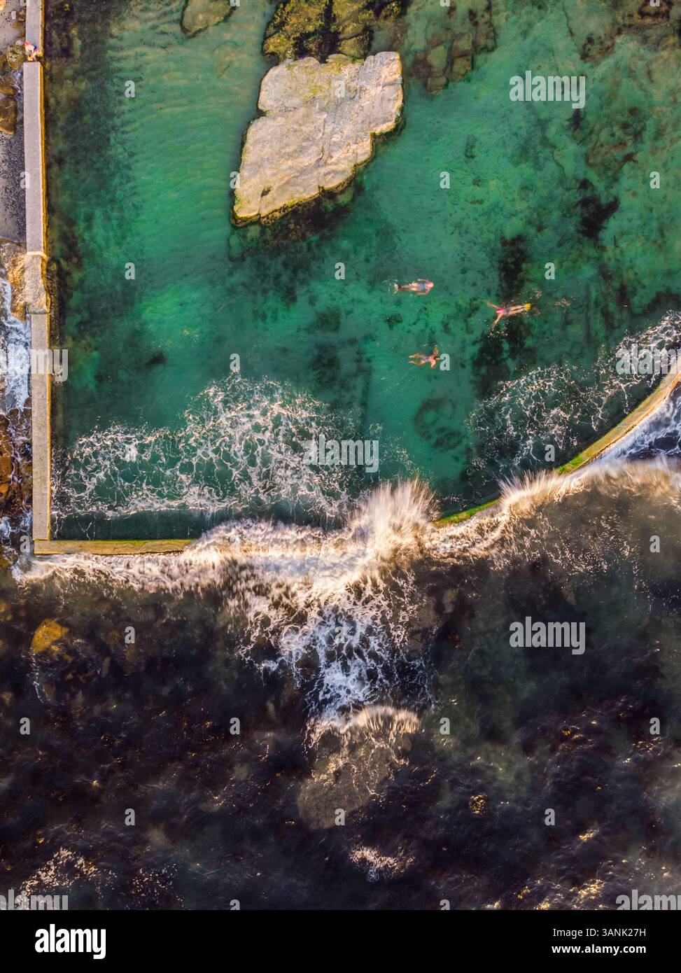 Aerial view of sunrise swimmers at Dalebrook tidal pool, Cape Town ...