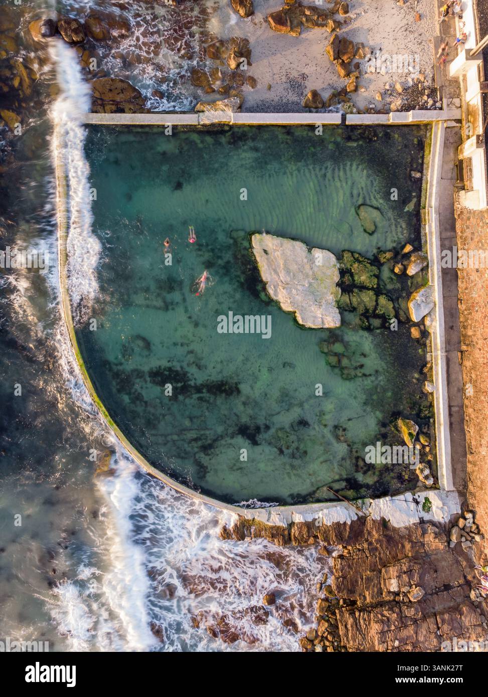 Aerial view of sunrise swimmers at Dalebrook tidal pool, Cape Town ...