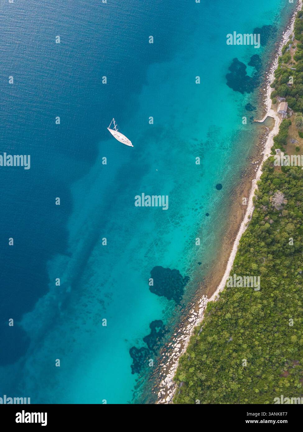 Aerial view of single speed boat floating over transparent water ...