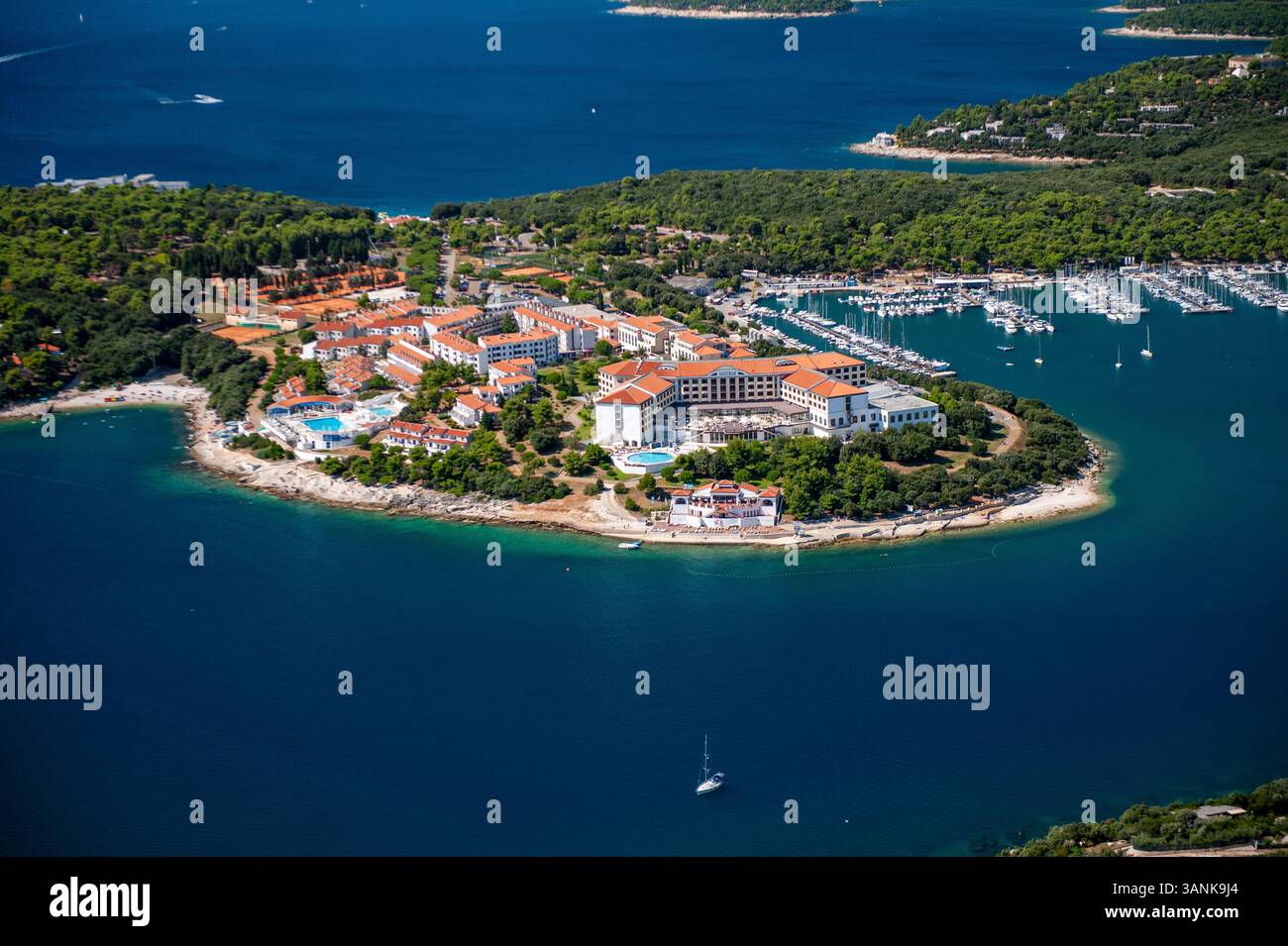 Aerial view of beautiful bay with luxurious hotel and marina surrounded ...