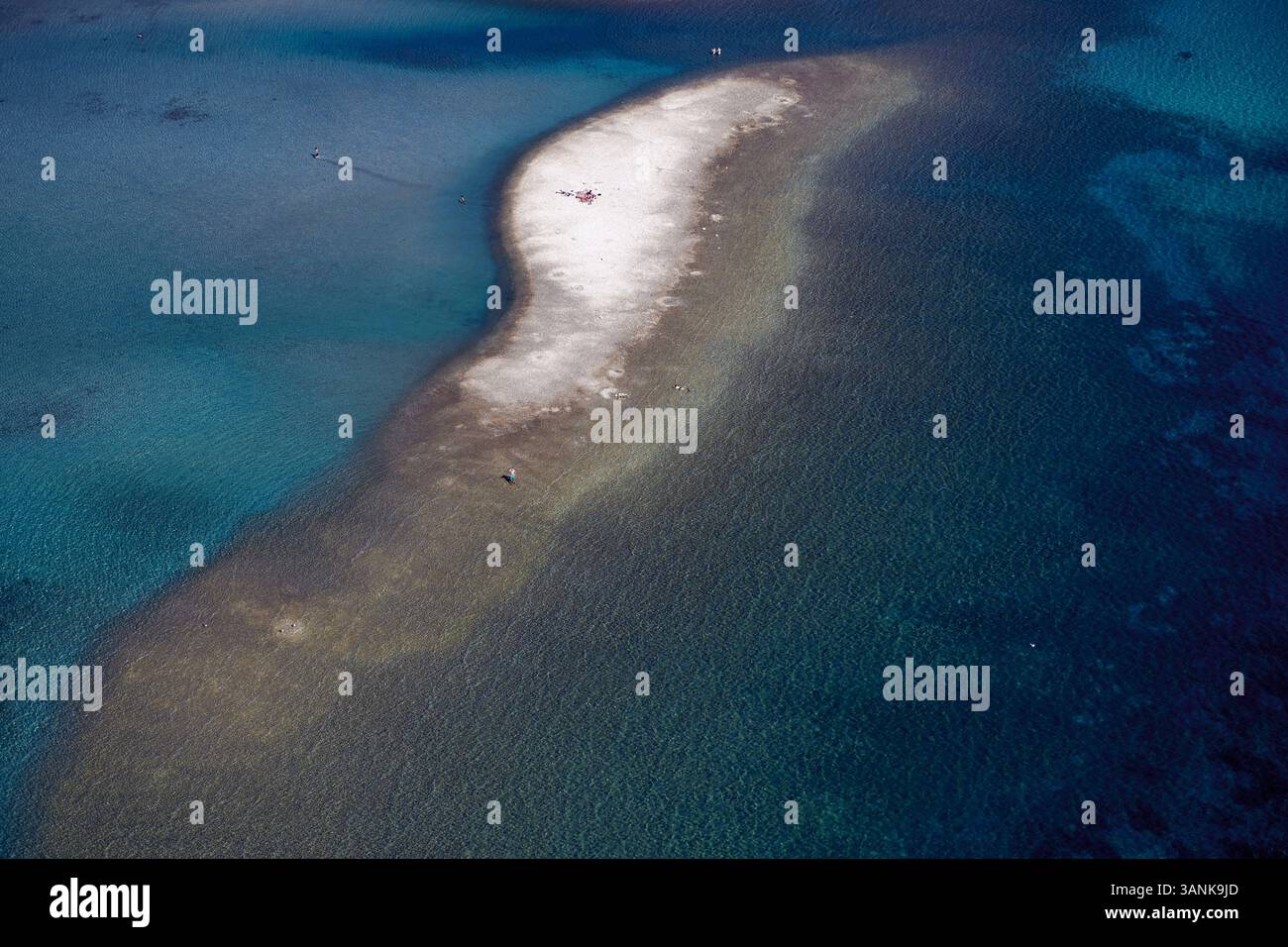 Aerial view of pristine beach with clear water and sandy shoreline ...