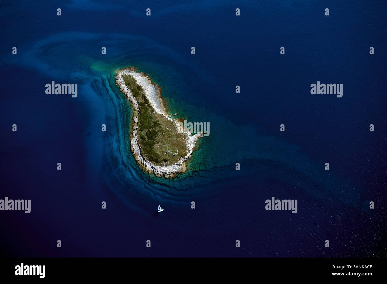 Aerial view of tranquil turquoise waters surrounding isolated Grunj ...