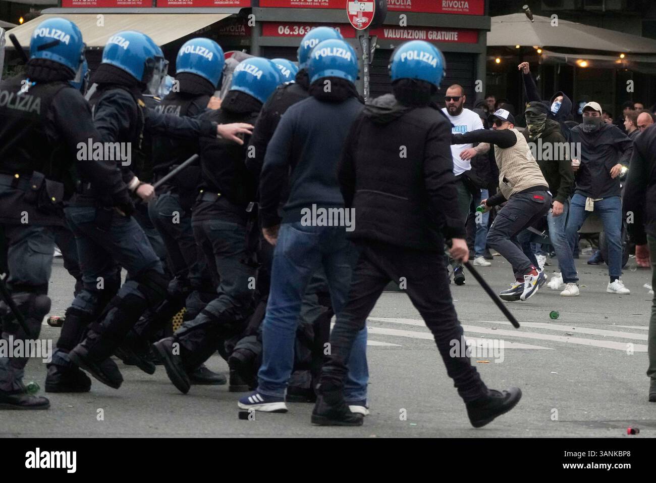 Lazio fans clash with Italian Policemen in riot gears outside the ...