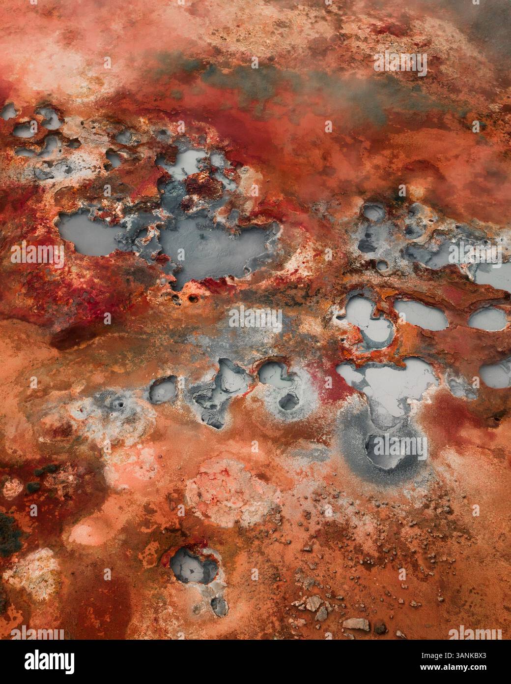 Aerial view of colorful geological formations and rugged patterns in a ...