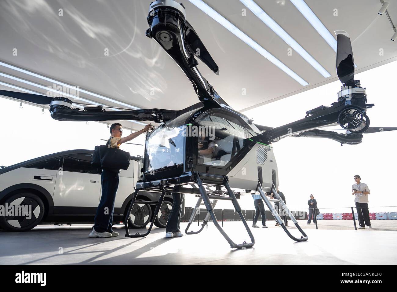 A XPeng AeroHT's flying vehicle is displayed at the company's showcase ...