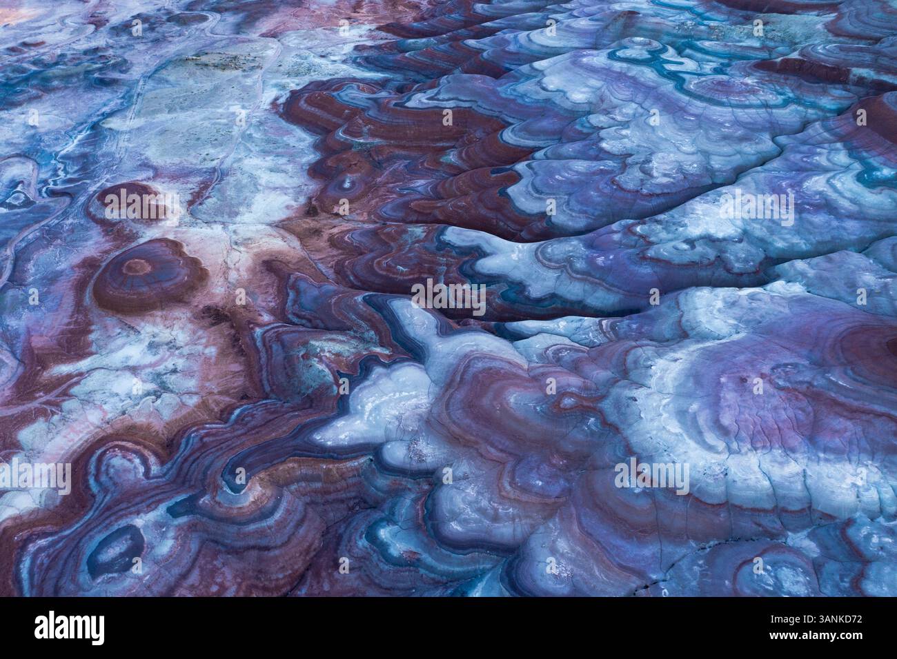 Aerial view of colorful geological formations and vibrant textures in a ...