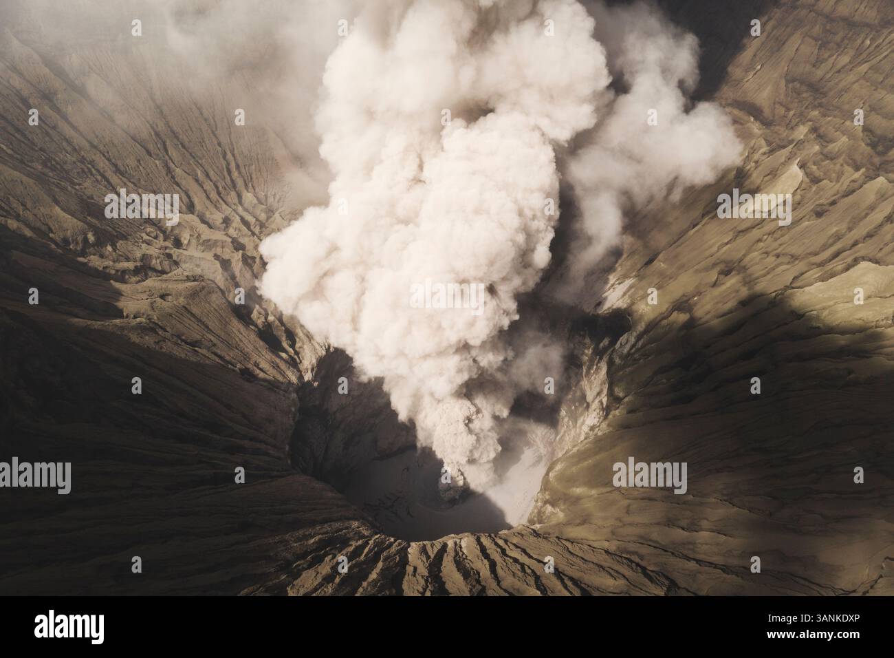 Aerial view of the active volcano with a dramatic eruption and smoky ...