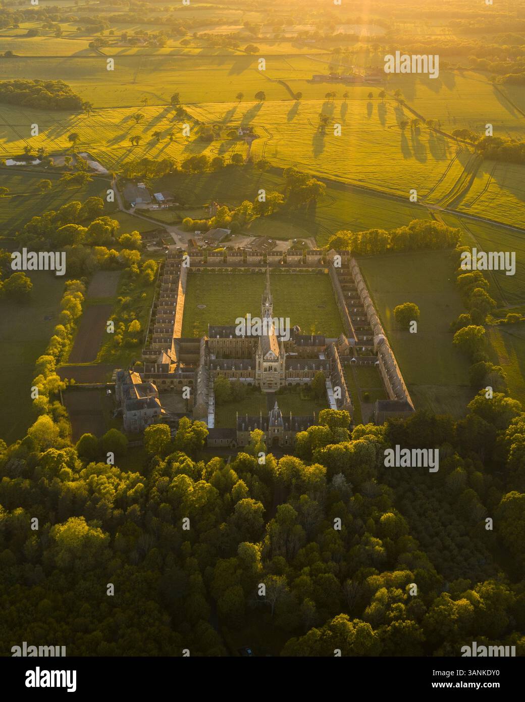 Aerial view of the historic castle surrounded by scenic fields and lush ...