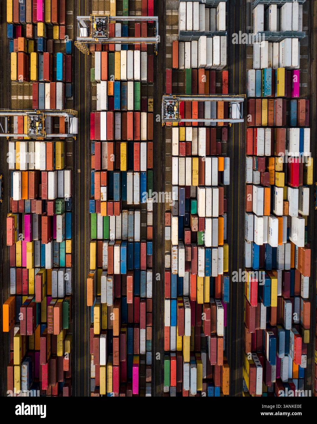 Aerial view of organized shipping containers in a colorful shipping ...