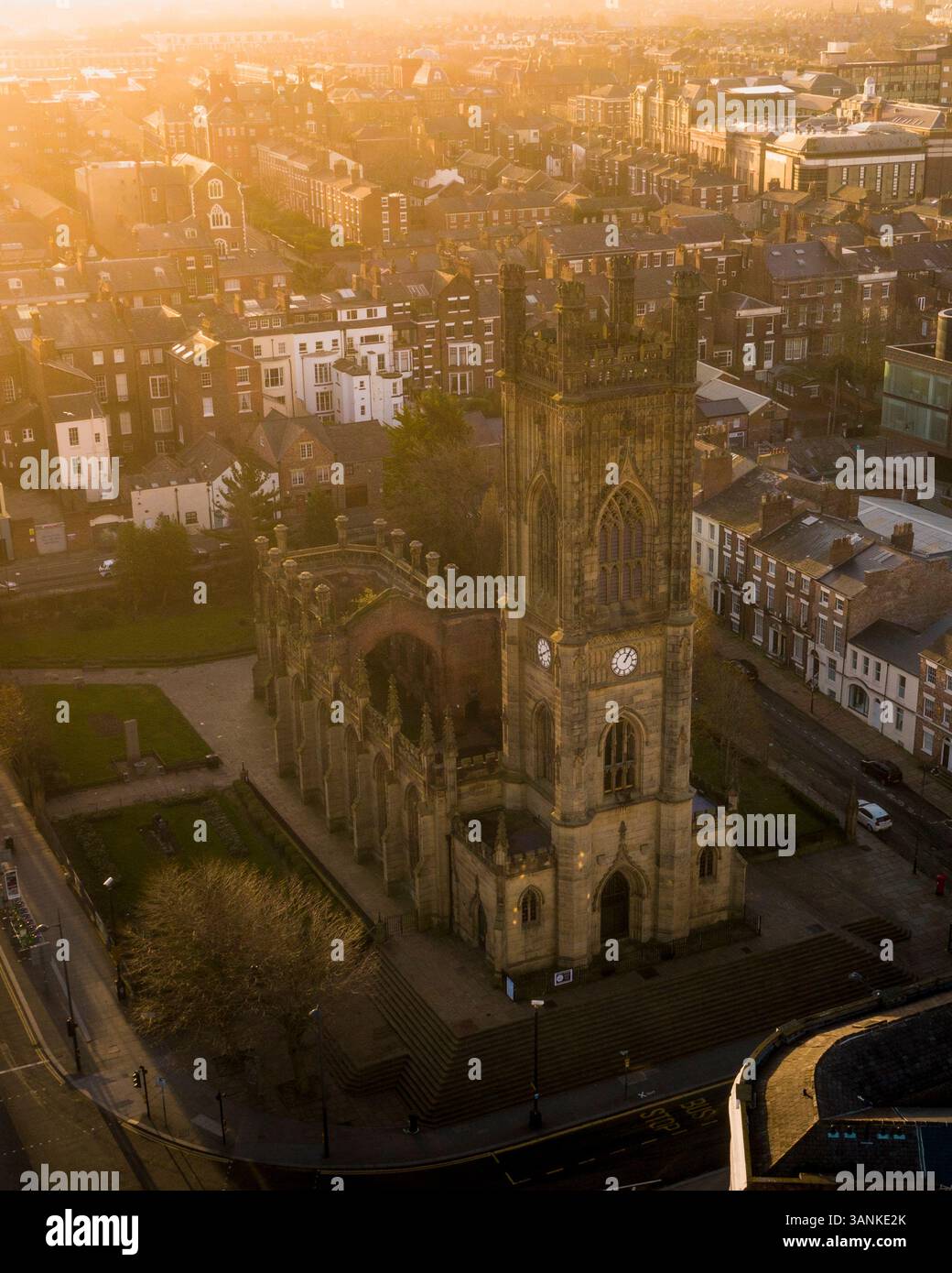 Aerial view of Liverpool cathedral at sunset with gothic architecture ...