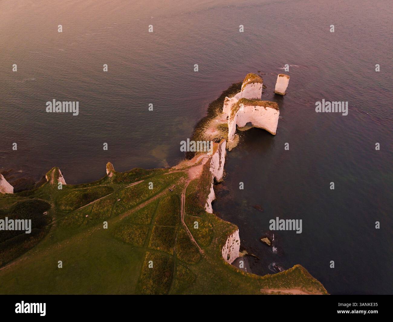 Aerial view of old harry rocks and tranquil sea surrounded by majestic ...