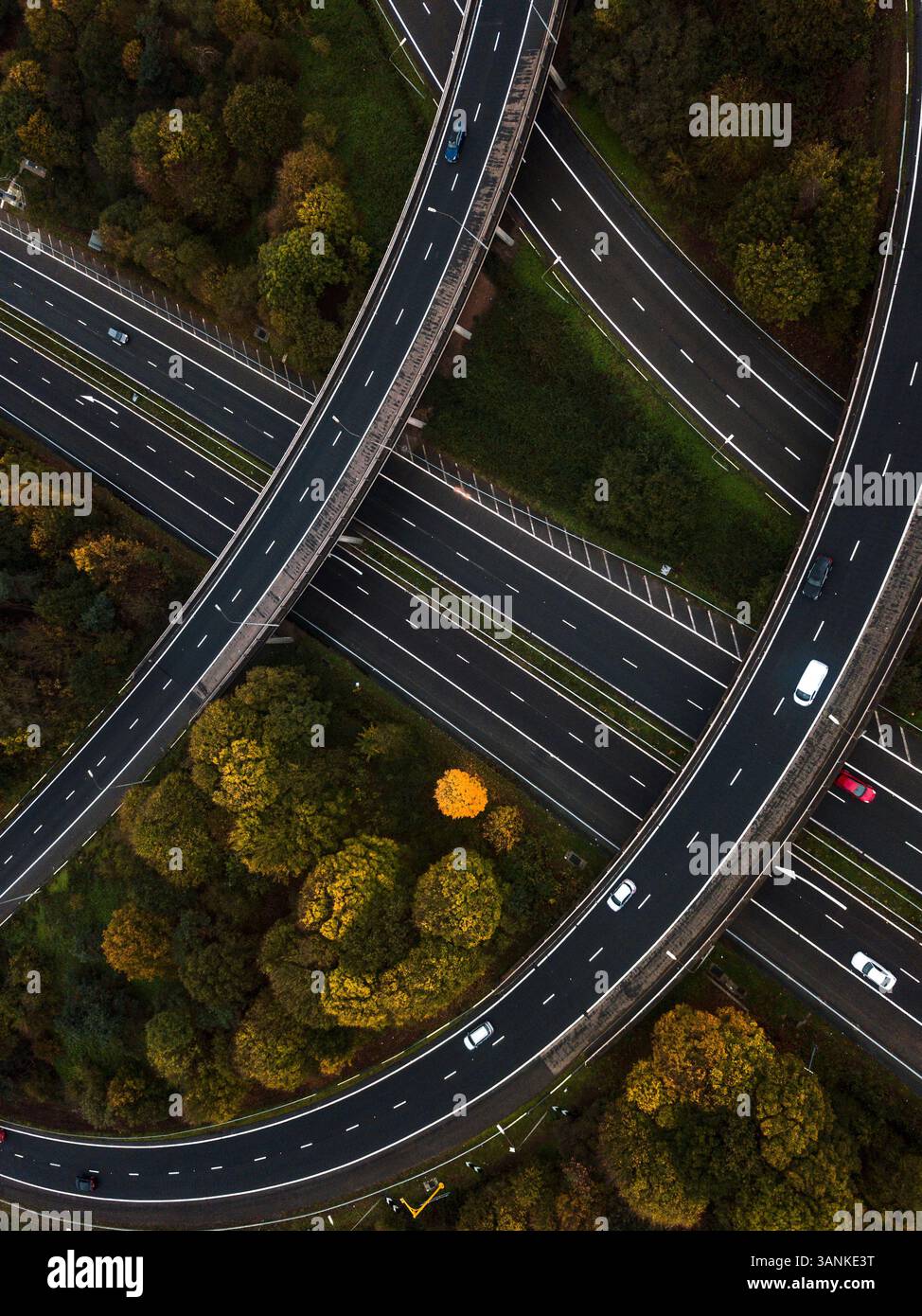 Aerial view of busy highway intersection with winding roads and traffic ...