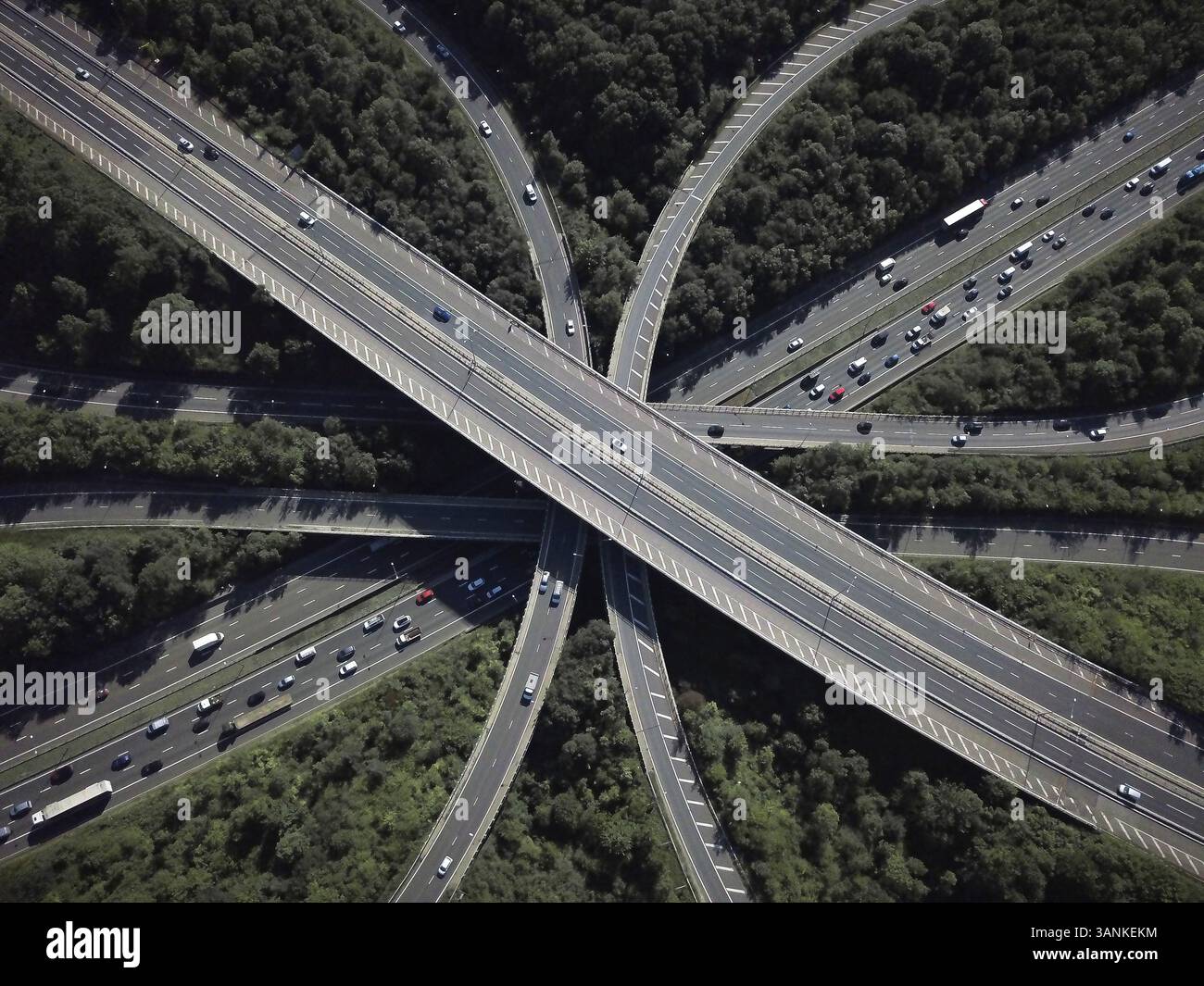 Aerial view of a busy highway intersection with winding roads amidst ...