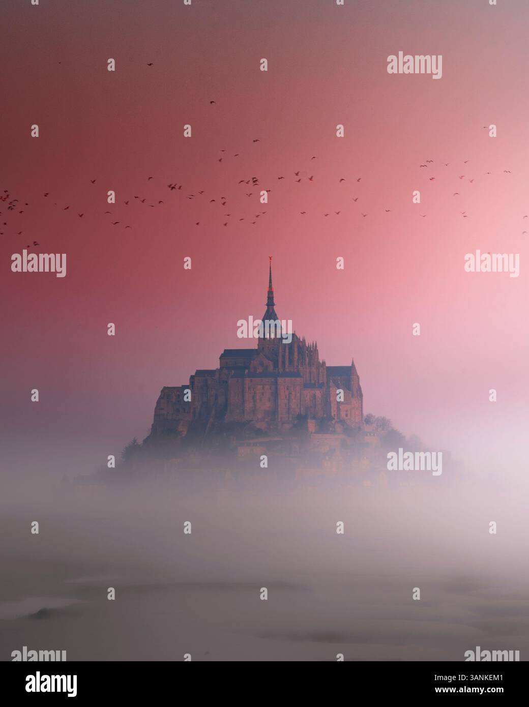 Aerial view of the majestic Mont Saint-Michel shrouded in mist at sunset, Normandy, France Stock ...