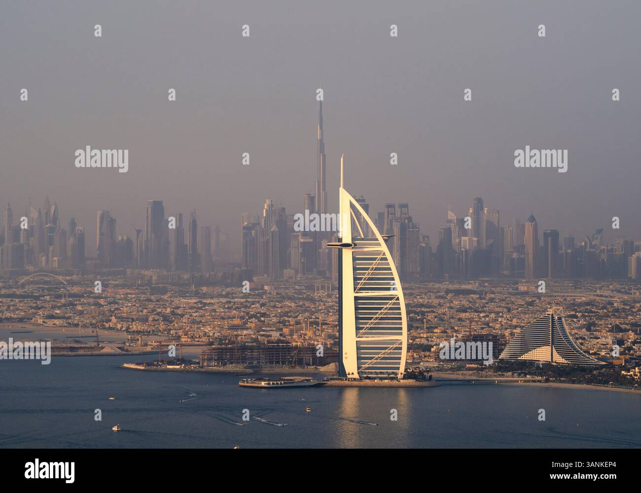 Aerial view of Dubai's coastal skyline at sunset, United Arab Emirates ...