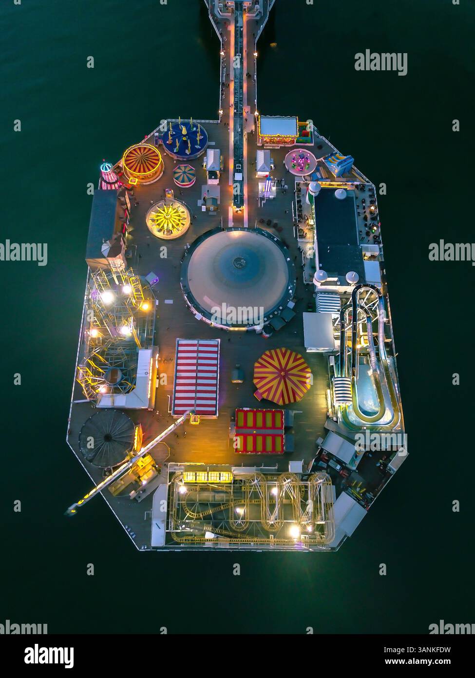 Aerial view of brighton pier illuminated at night with colorful ...