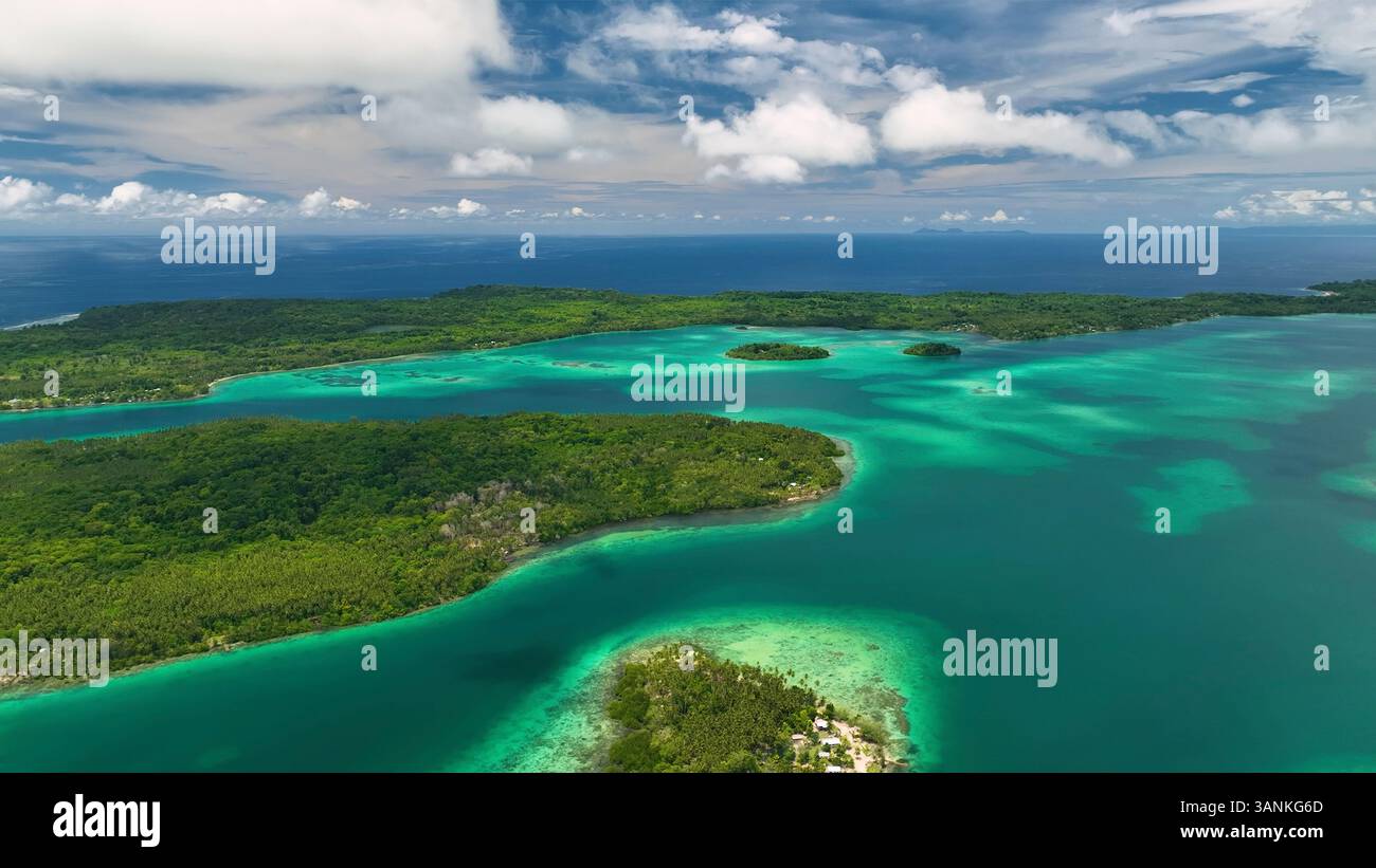 Aerial view of a beautiful tropical island with clear blue water and ...