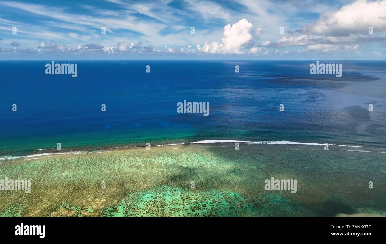 Aerial view of tropical reef and clear ocean under a sunny sky, Avarua ...