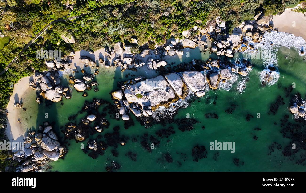 Aerial view of boulders beach with clear water and abstract wave ...