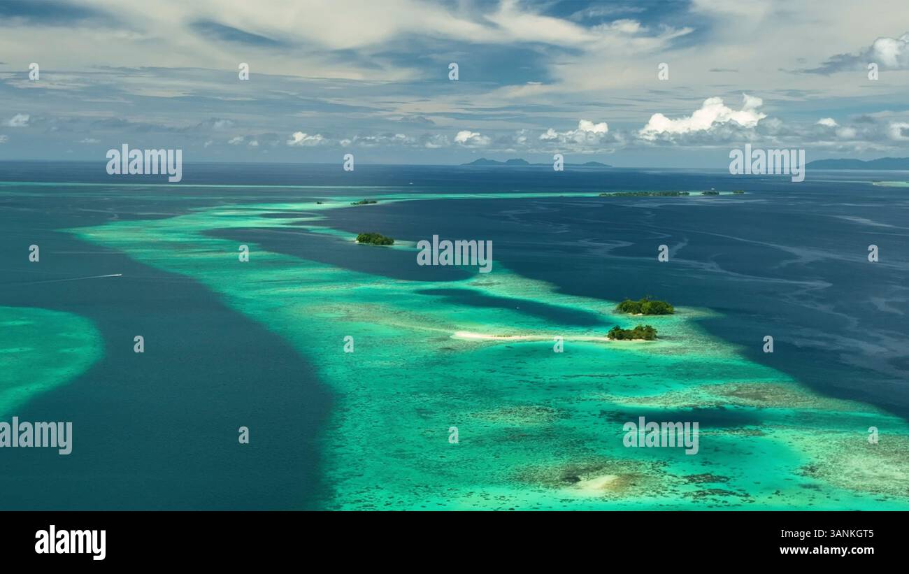 Aerial view of tropical island with beautiful reef and turquoise ocean ...