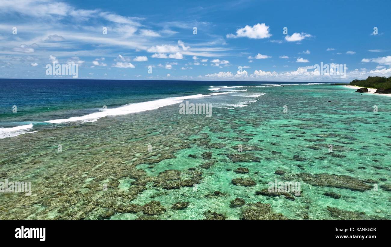 Aerial view of beautiful tropical reef and clear turquoise ocean with ...
