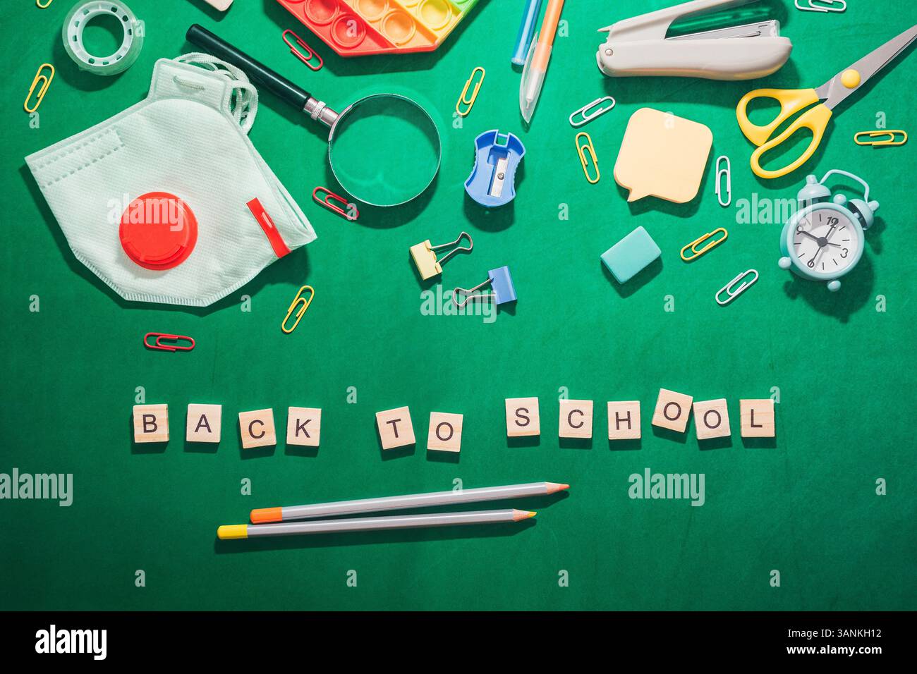 Back to school is written on a green background with various school ...