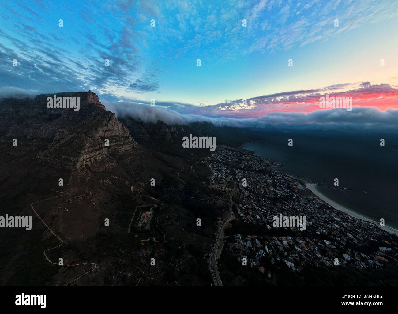 Aerial view of table mountain surrounded by clouds at sunset over the ...