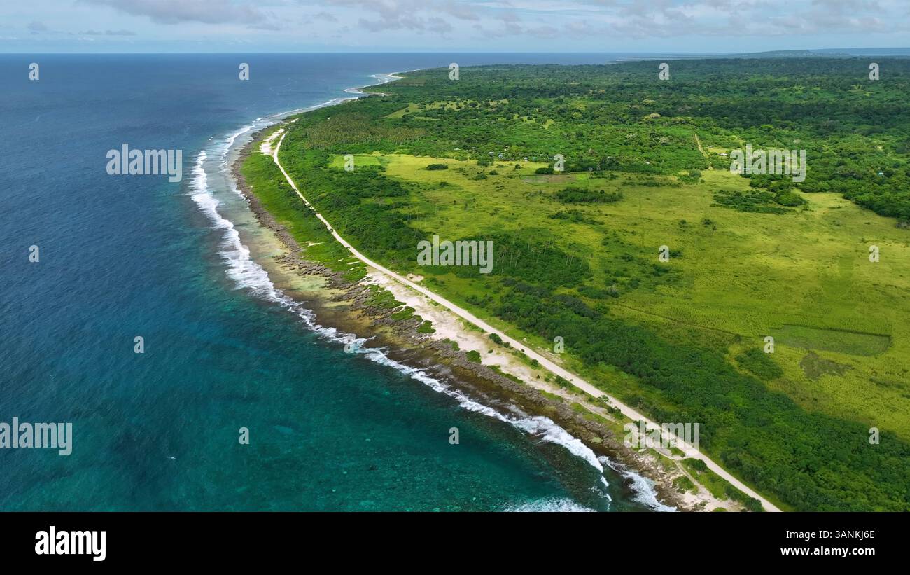 Aerial view of a beautiful tropical island with lush greenery, pristine ...