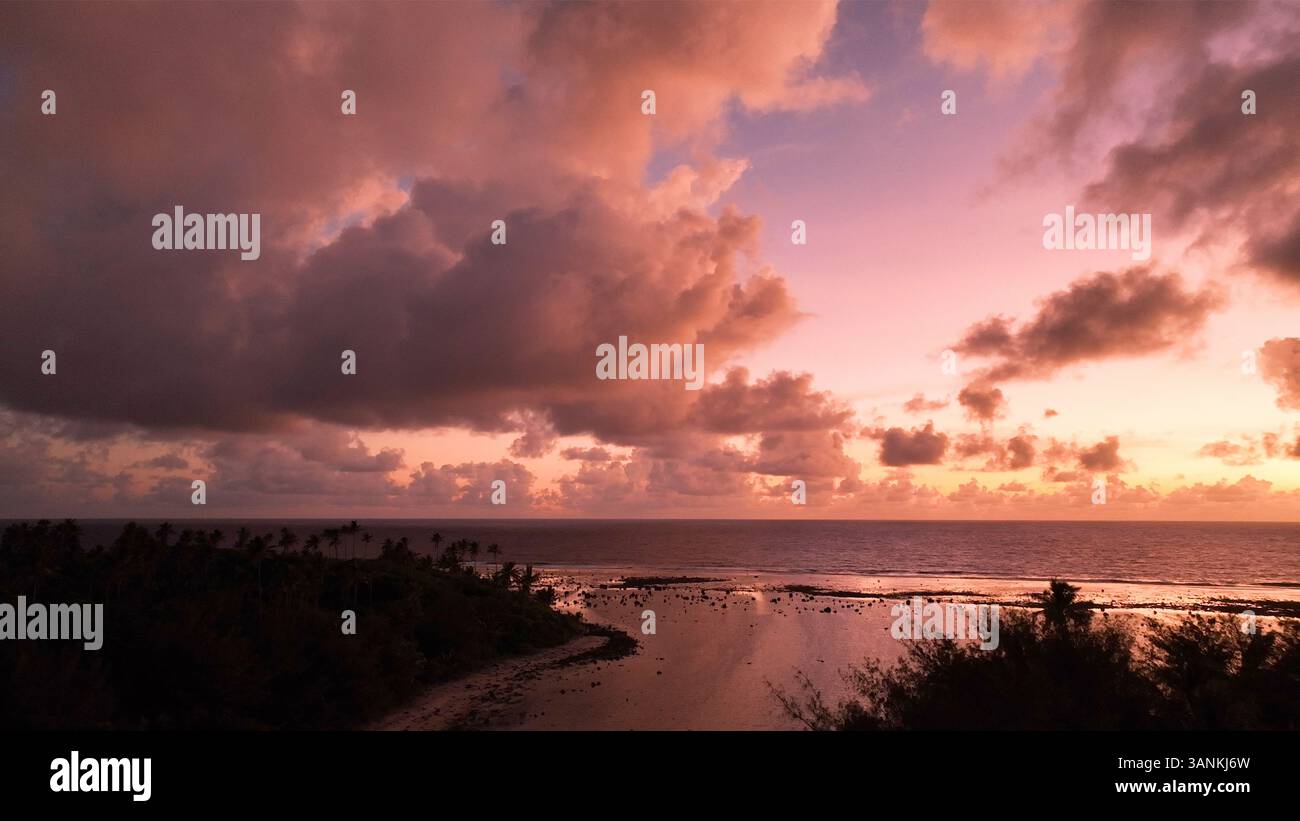 Aerial view of serene sunrise over beautiful islands and tranquil reef ...