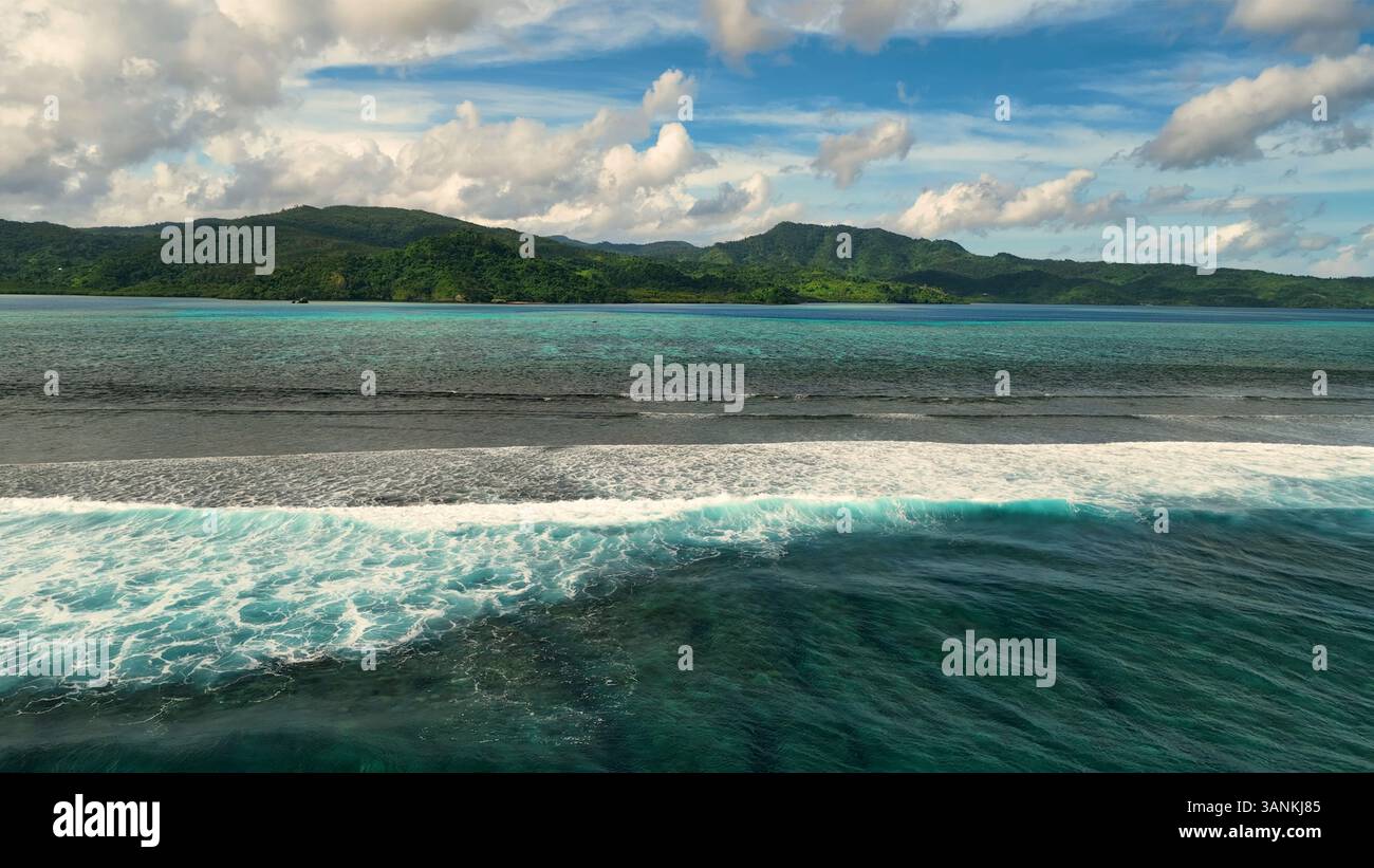 Aerial view of serene turquoise waters and beautiful coral reef with ...