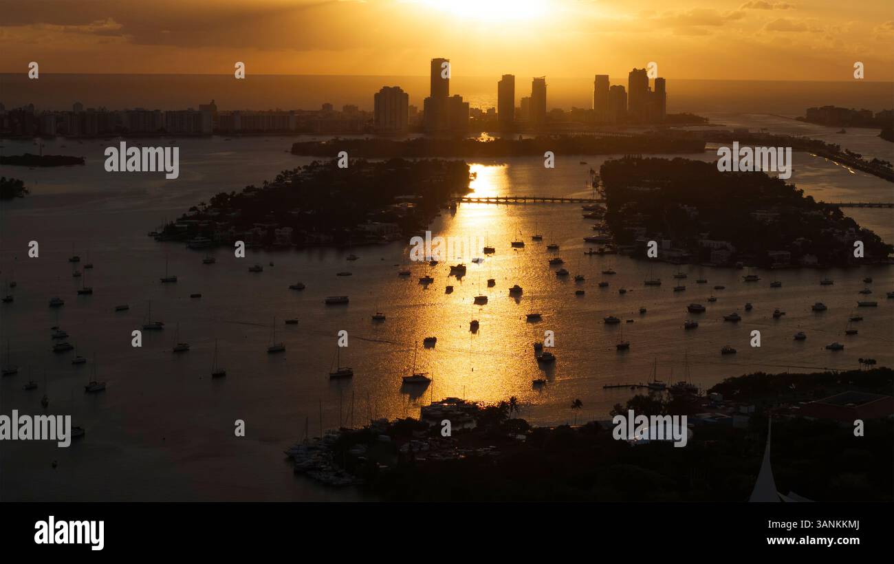 Aerial view of sunrise over Miami Beach with PortMiami and a beautiful ...