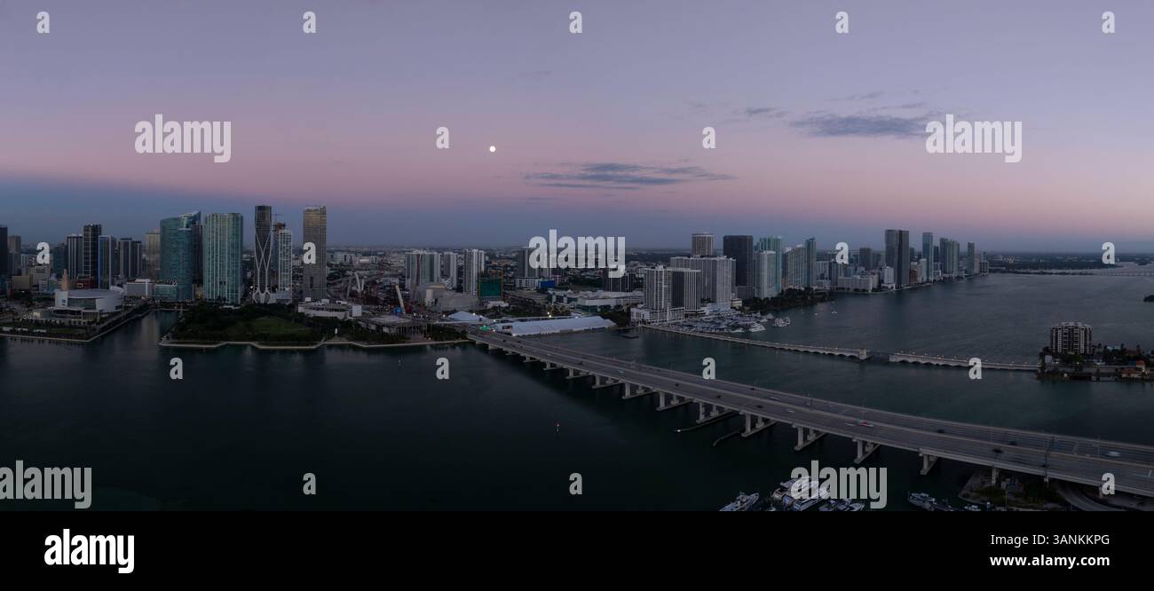 Aerial view of panoramic skyline with skyscrapers and moon over ...