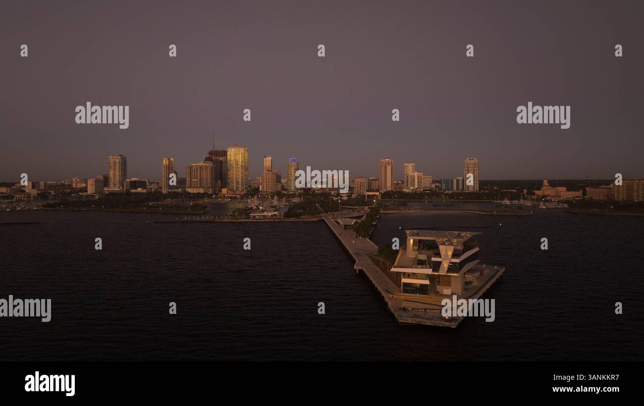 Aerial view of St. Pete Pier at sunrise with a serene skyline and ...