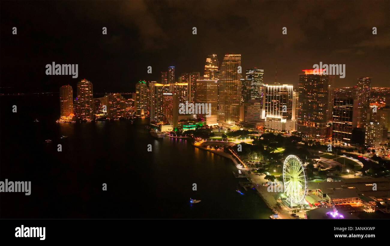Aerial view of vibrant Miami skyline with illuminated skyscrapers and ...