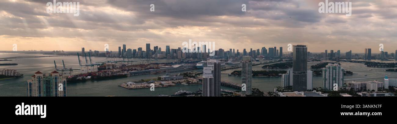 Aerial view of vibrant downtown skyline with PortMiami and clouds ...