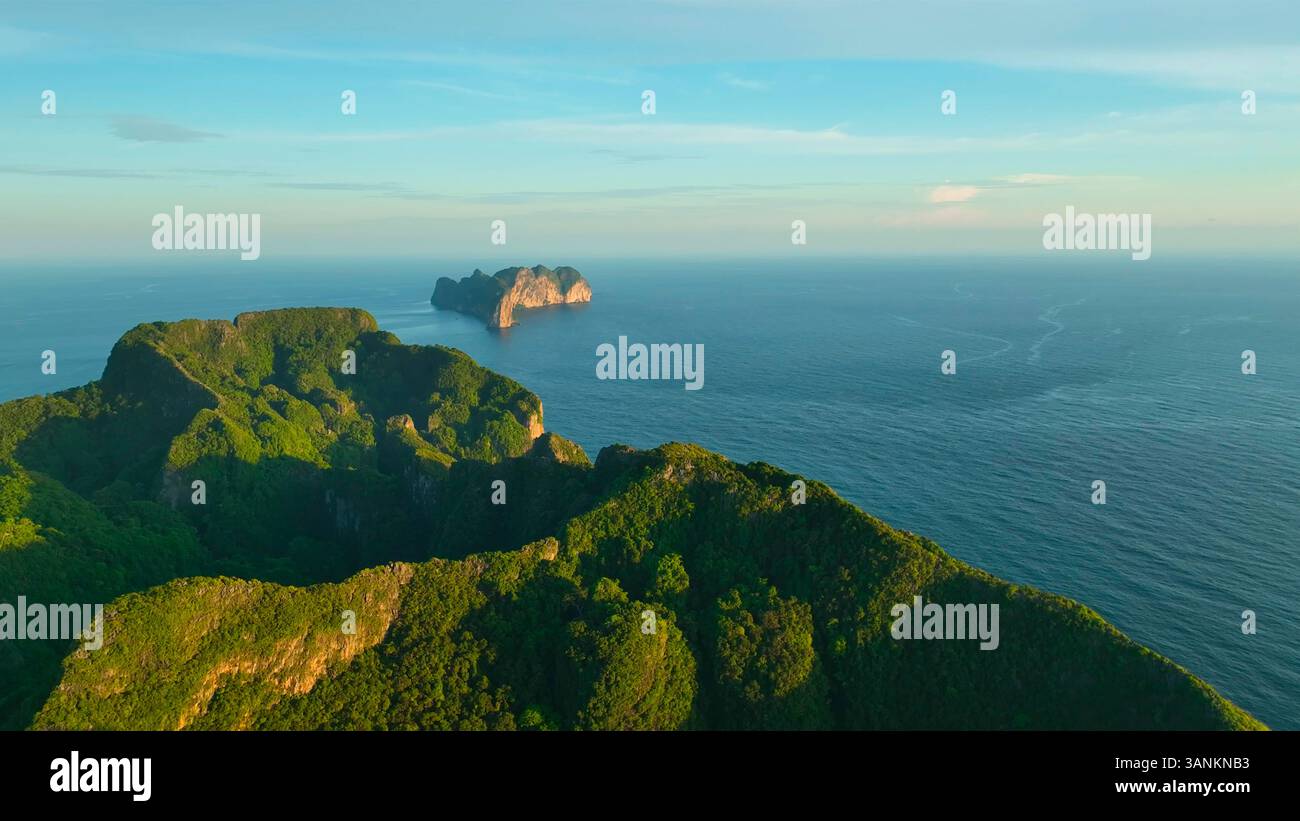 Aerial view of beautiful tropical island with lush greenery and majestic mountains in the Indian ...