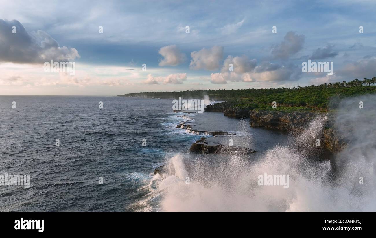 Aerial view of beautiful tropical island with rugged cliffs and azure ...