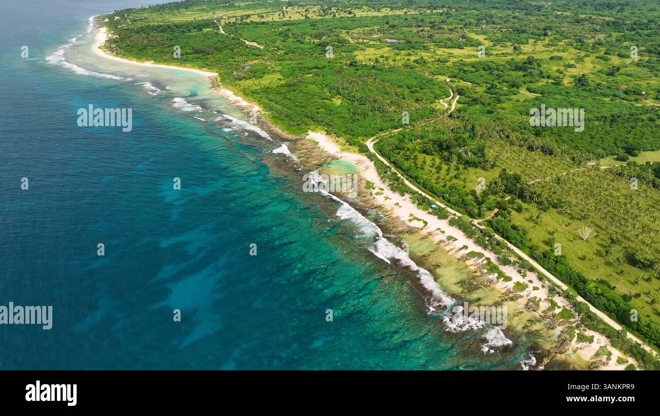 Aerial view of a beautiful tropical island with turquoise water, lush ...