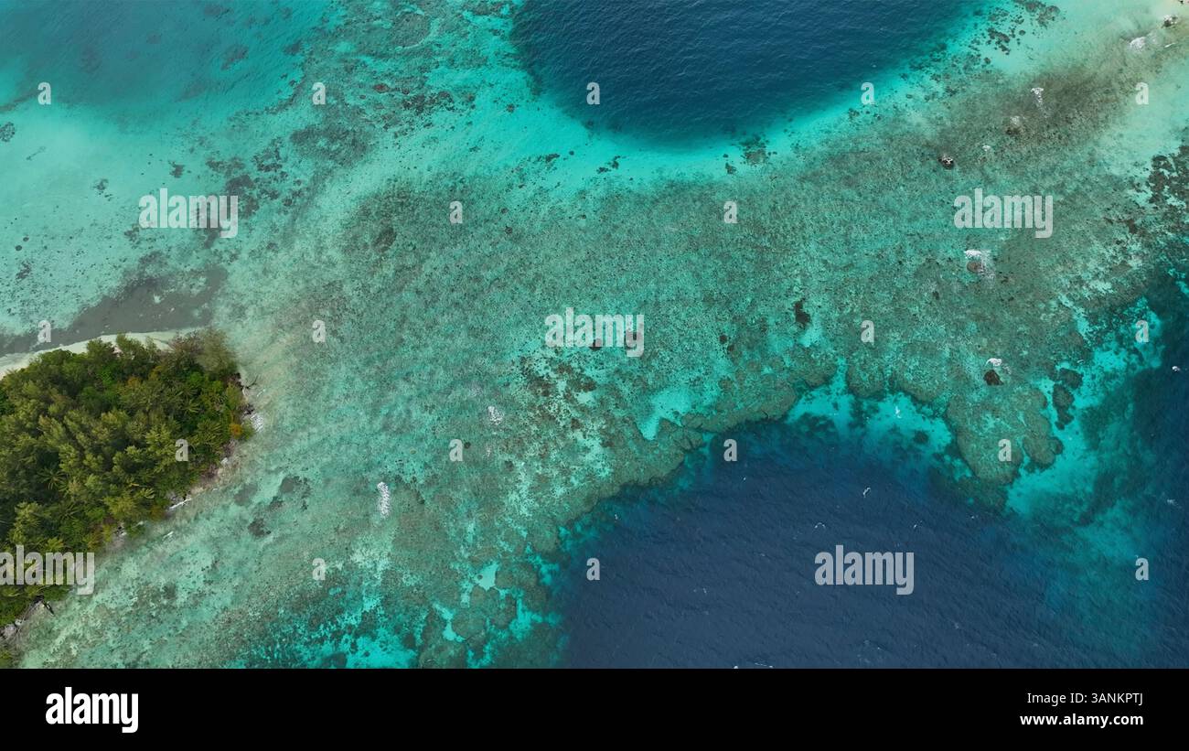 Aerial view of tropical reef and ocean with beautiful island, Western ...