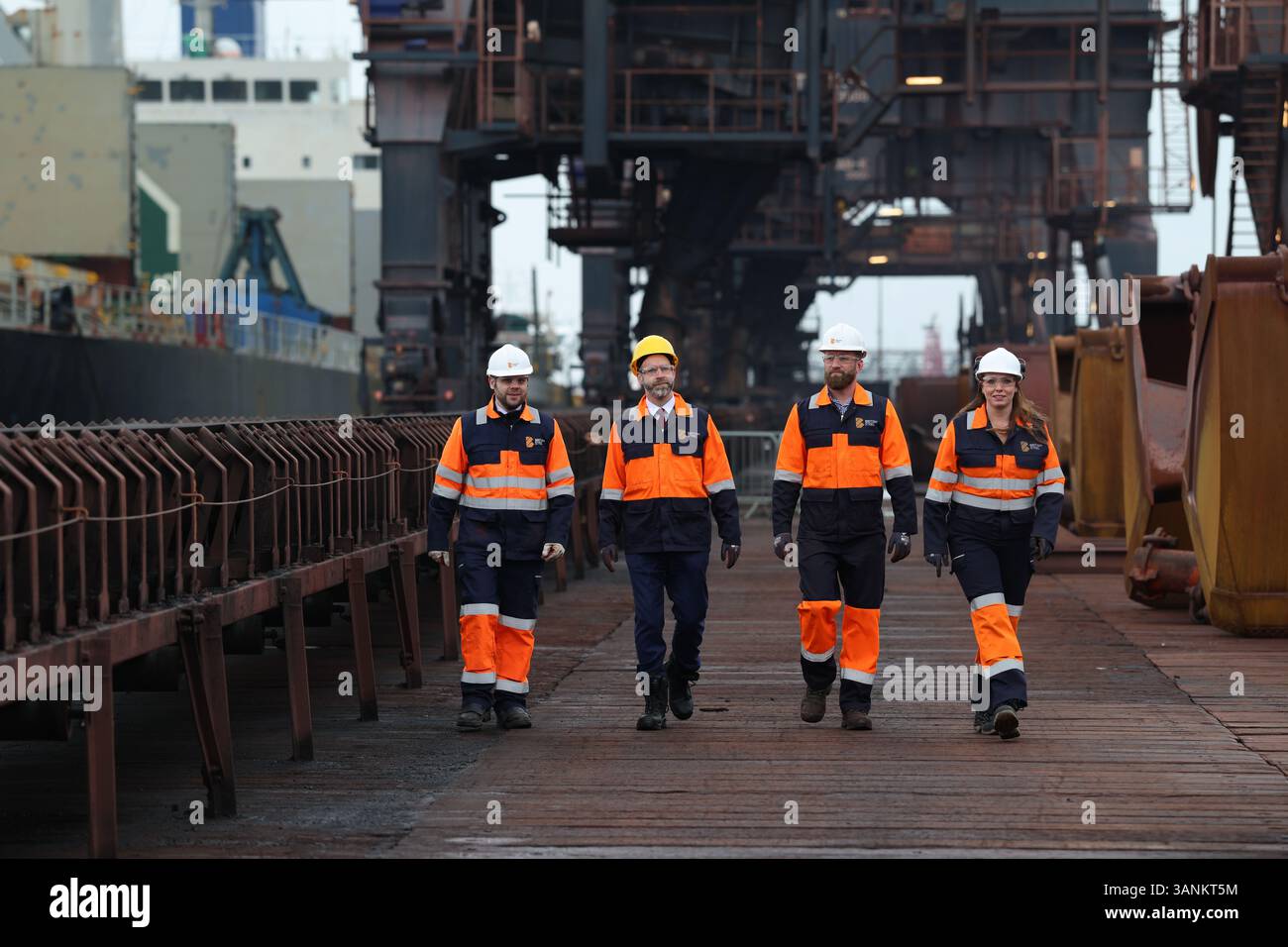 Business Secretary Jonathan Reynolds (second left) tours the premises ...